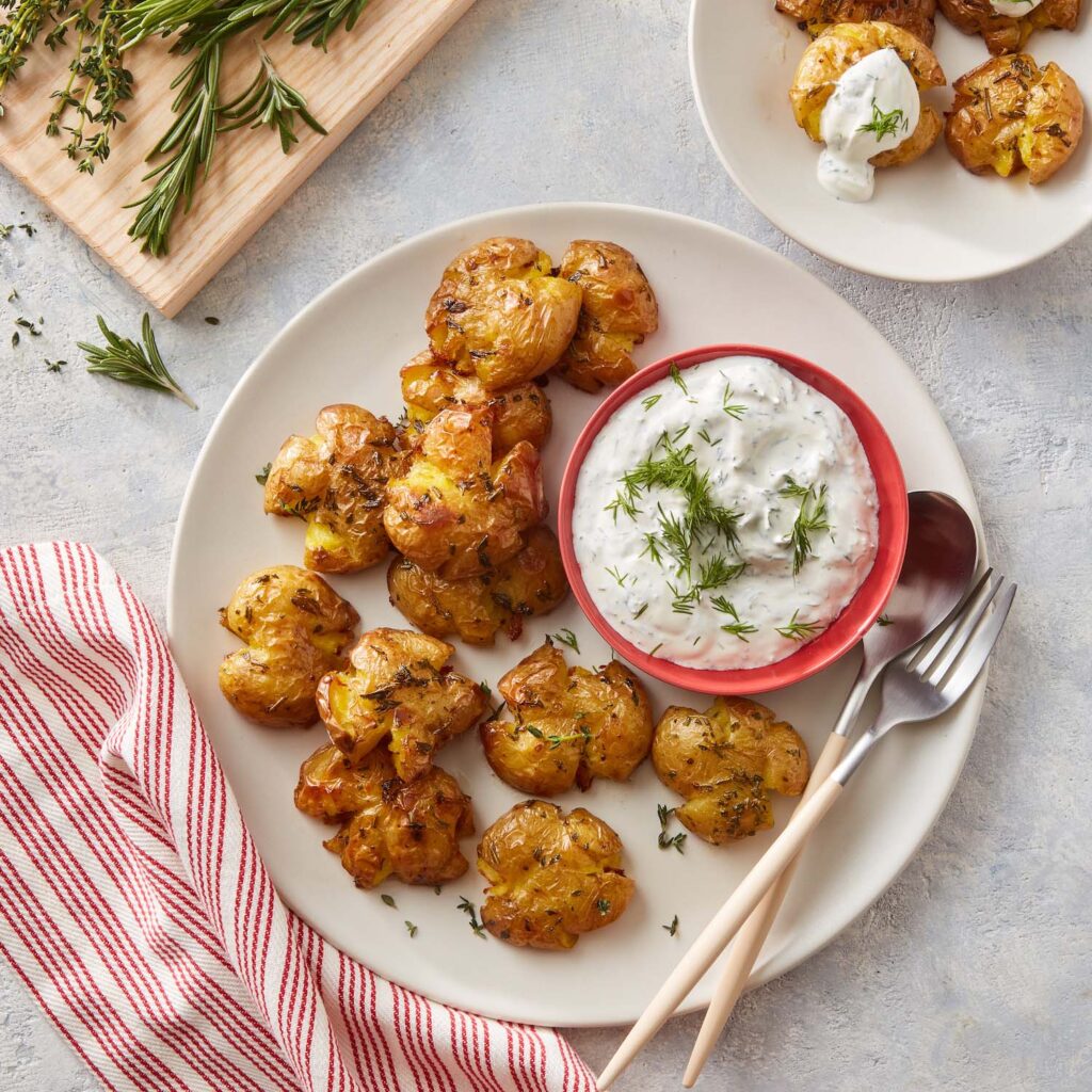 Garlic & Herb Smashed Potatoes with Dill Sour Cream | Breakstone's